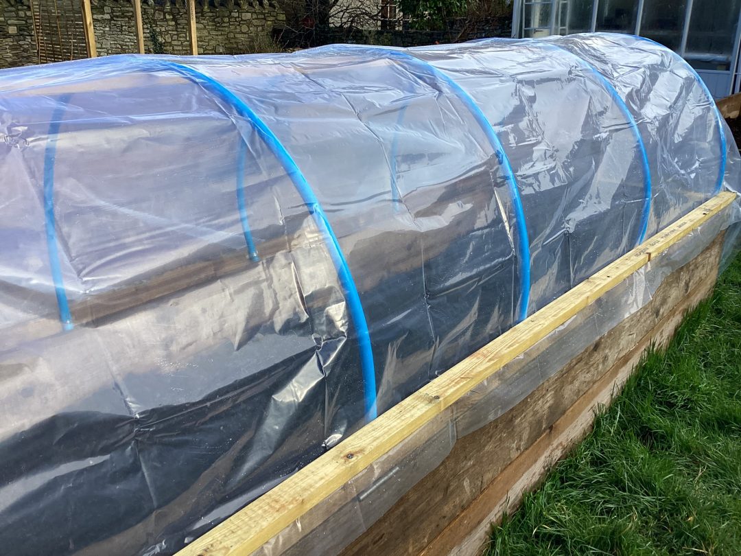 How To Build a Hoop House With PVC Pipe In 4 Easy Steps - Micro Farm Days