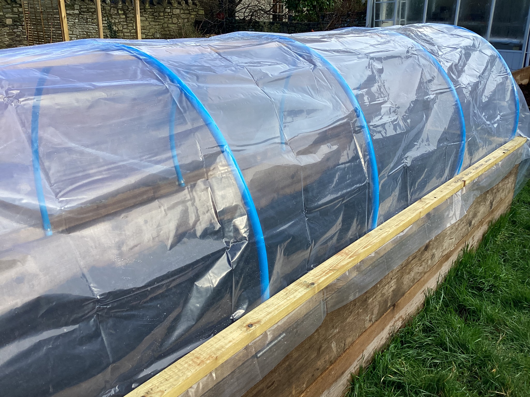 How To Build a Hoop House With PVC Pipe In 4 Easy Steps - Micro Farm Days